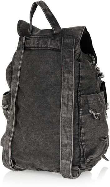 Topshop Ripped Denim Backpack in Black | Lyst