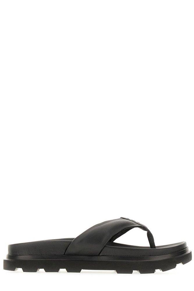 UGG Capitola Logo Embossed Flip Slides in Black | Lyst