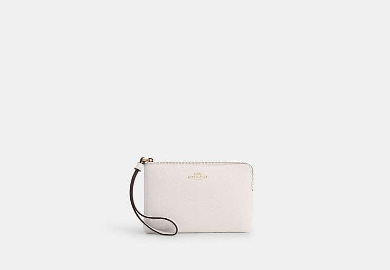 COACH Corner Zip Wristlet in Black | Lyst