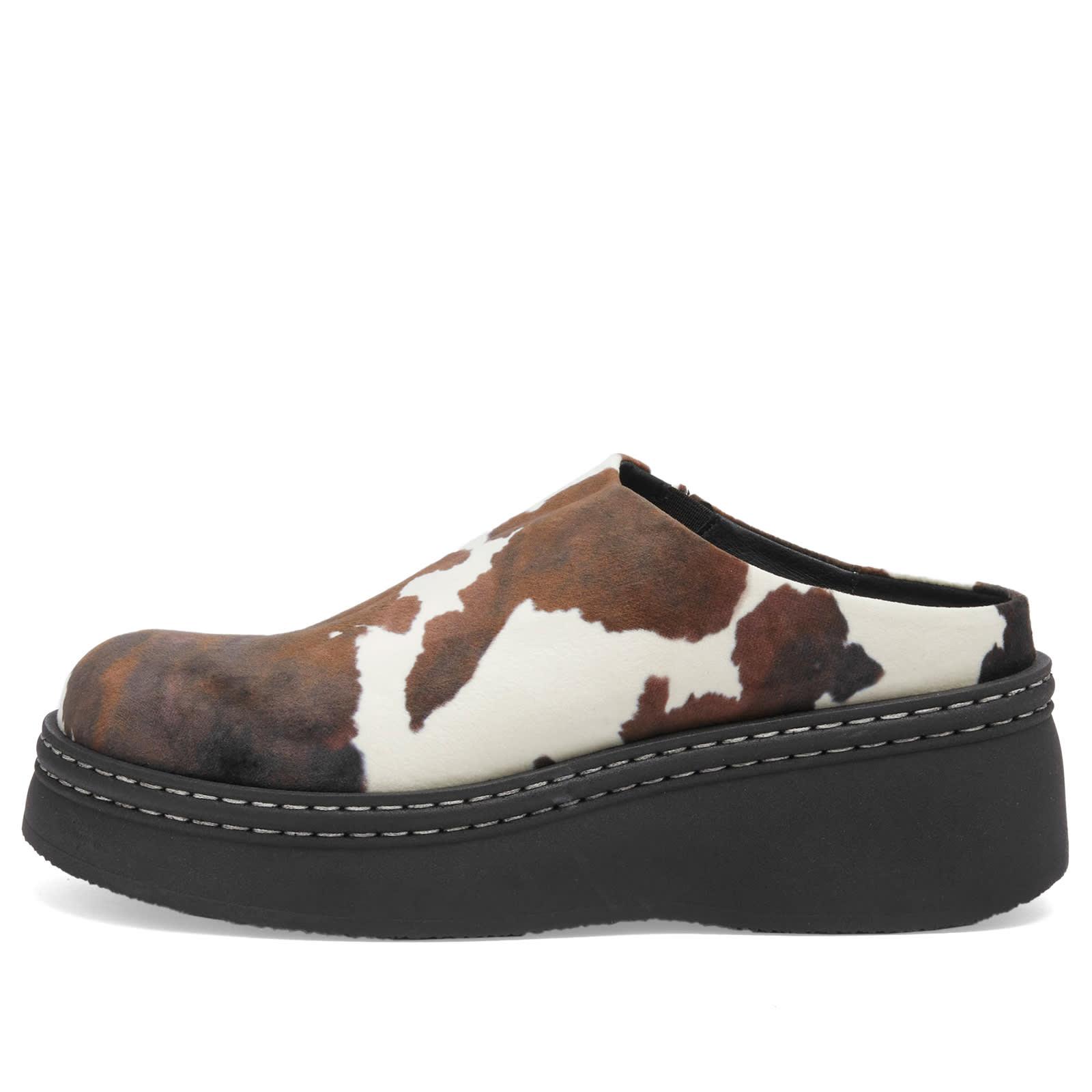 Miista Cow Print Wedge Mules in Brown | Lyst