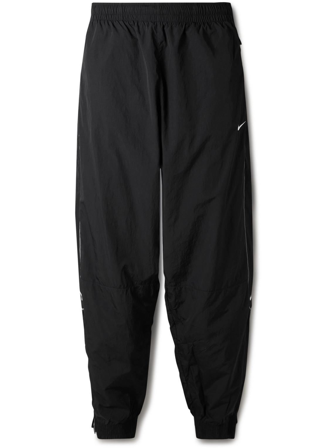Nike Solo Swoosh Tapered Logo-embroidered Taffeta Track Pants in Black ...
