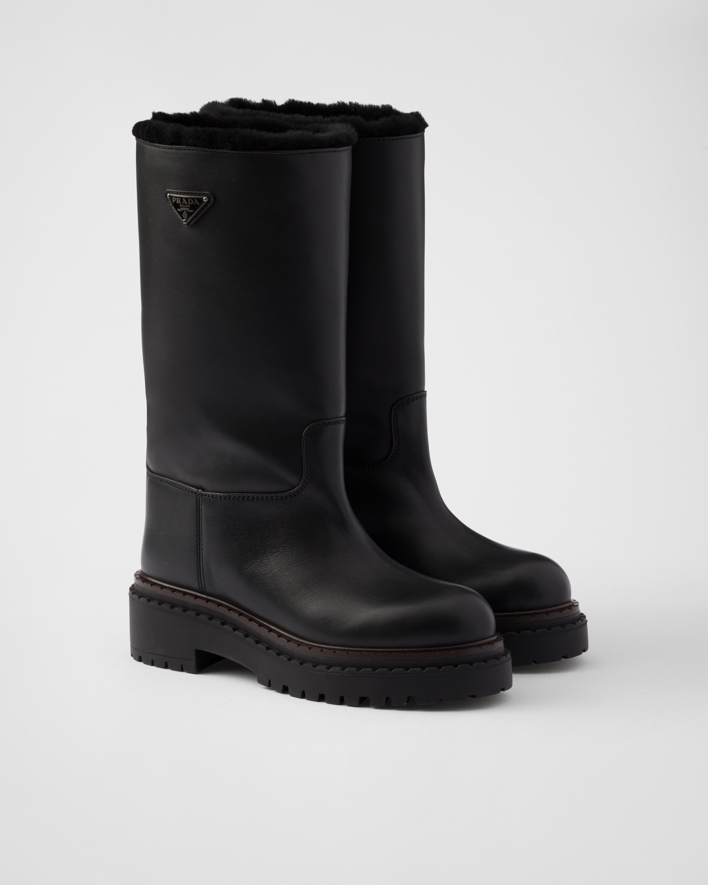 Prada Leather And Shearling Boots in Black | Lyst